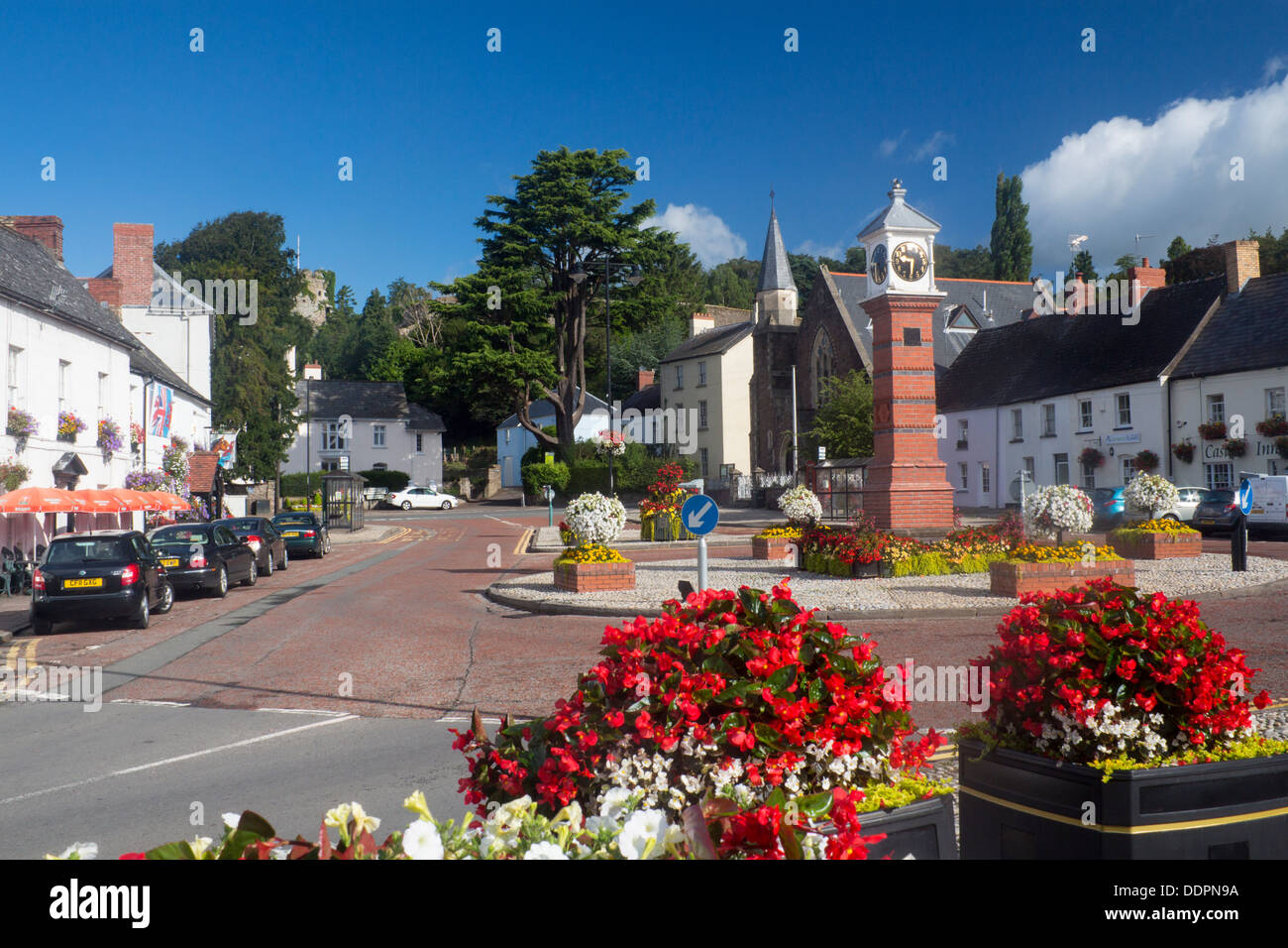 Usk Twyn Square in summer with flowers in bloom,clock tower, pubs on ...