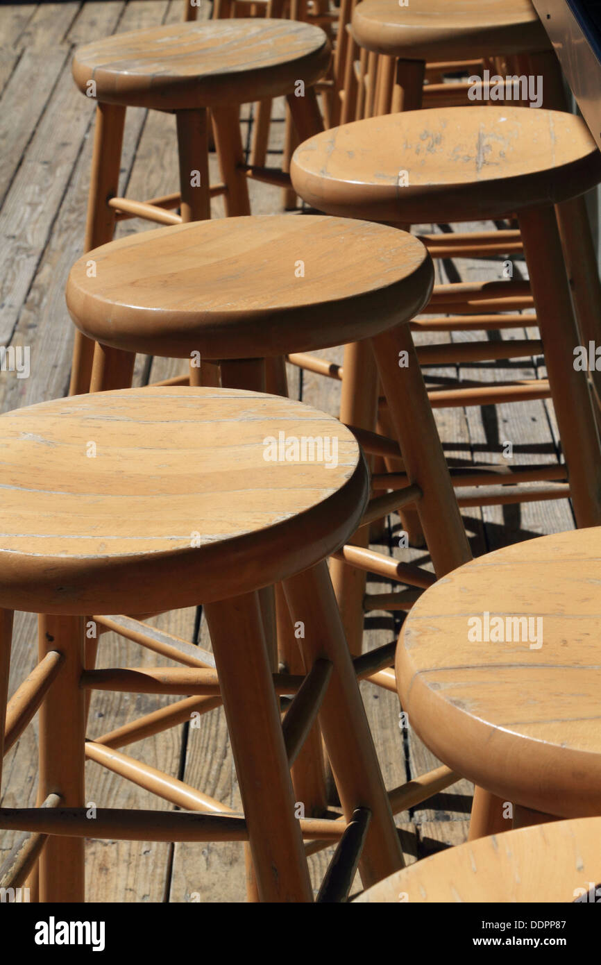 Empty wooden bar stools at a tiki bar in Point Pleasant Beach, New ...