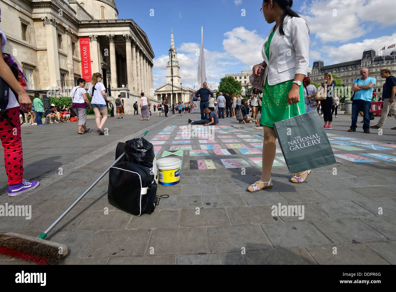 Street artist drawing national flags at Trafalgar Square, London, UK ...