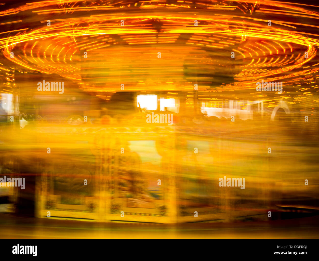 An abstract image of an illuminated carousel at speed Stock Photo - Alamy