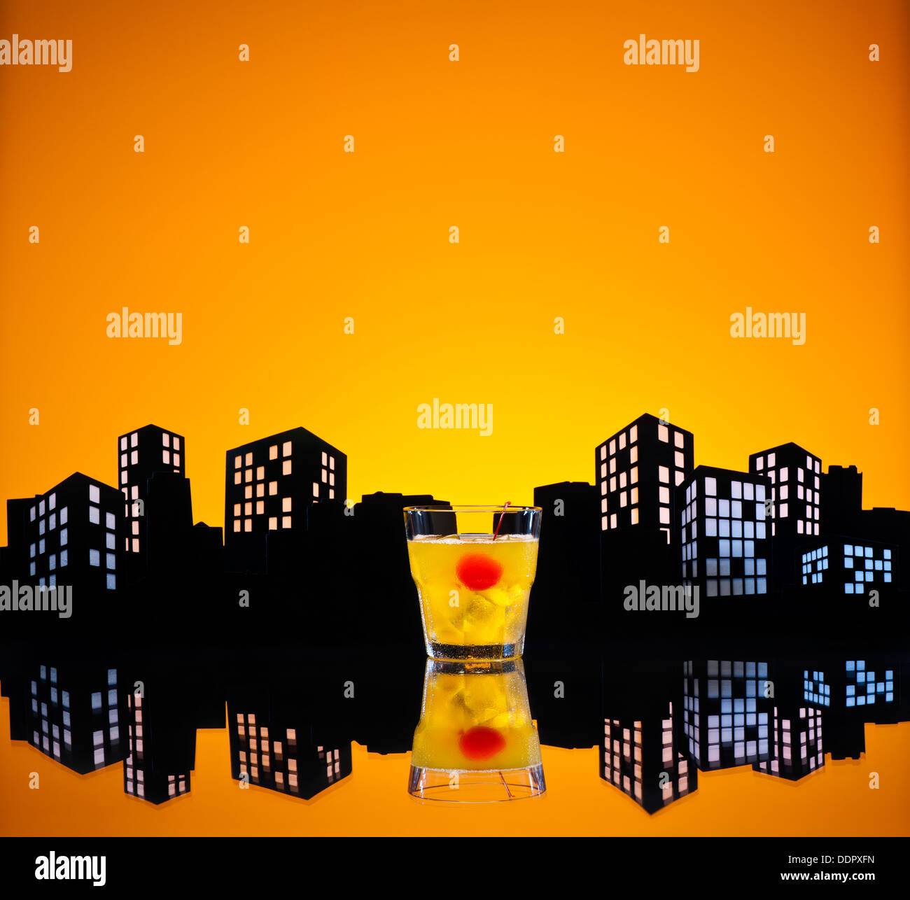 Skrew Driver cocktail in city skyline setting Stock Photo - Alamy