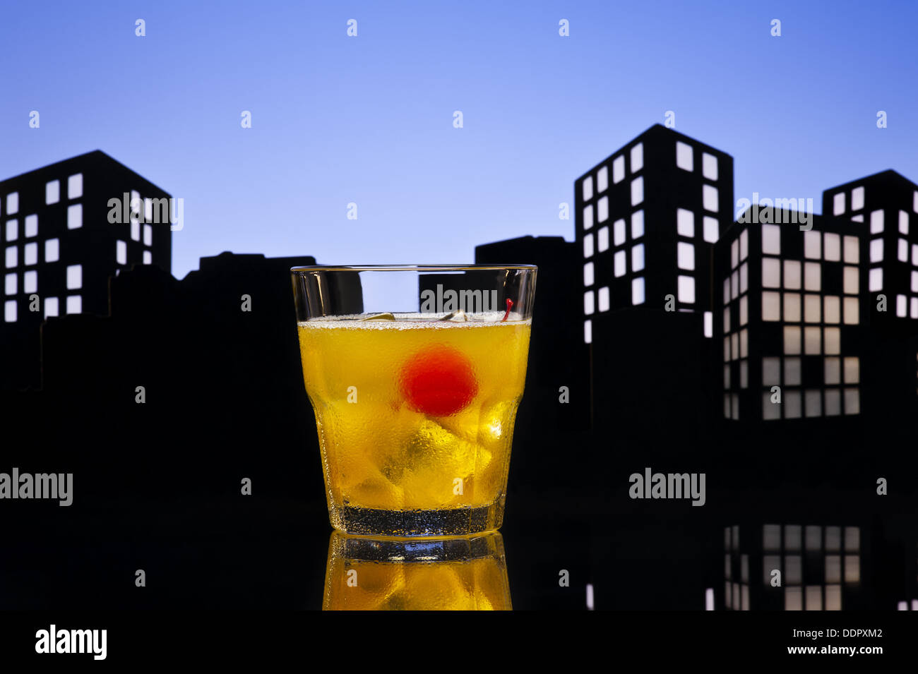 Skrew Driver cocktail in city skyline setting Stock Photo - Alamy
