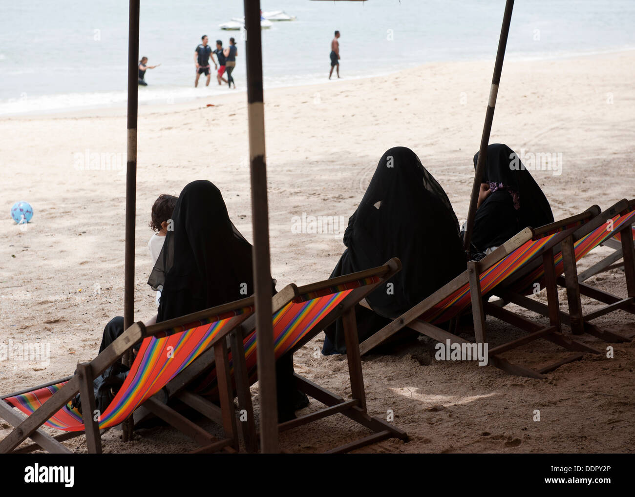 Muslim women observe strict rites at the beach, Penang Stock Photo - Alamy