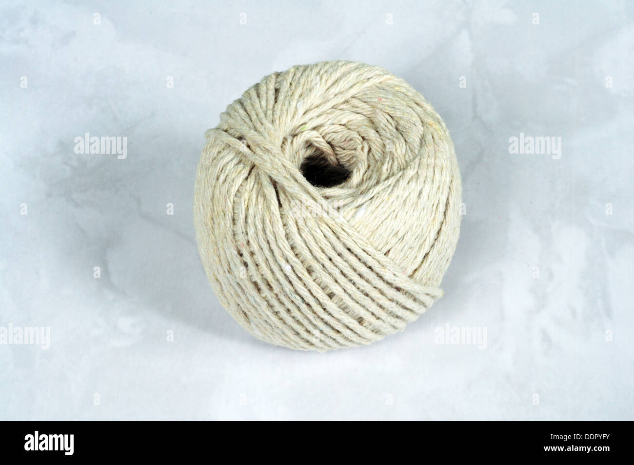 Ball of string against a white background Stock Photo - Alamy