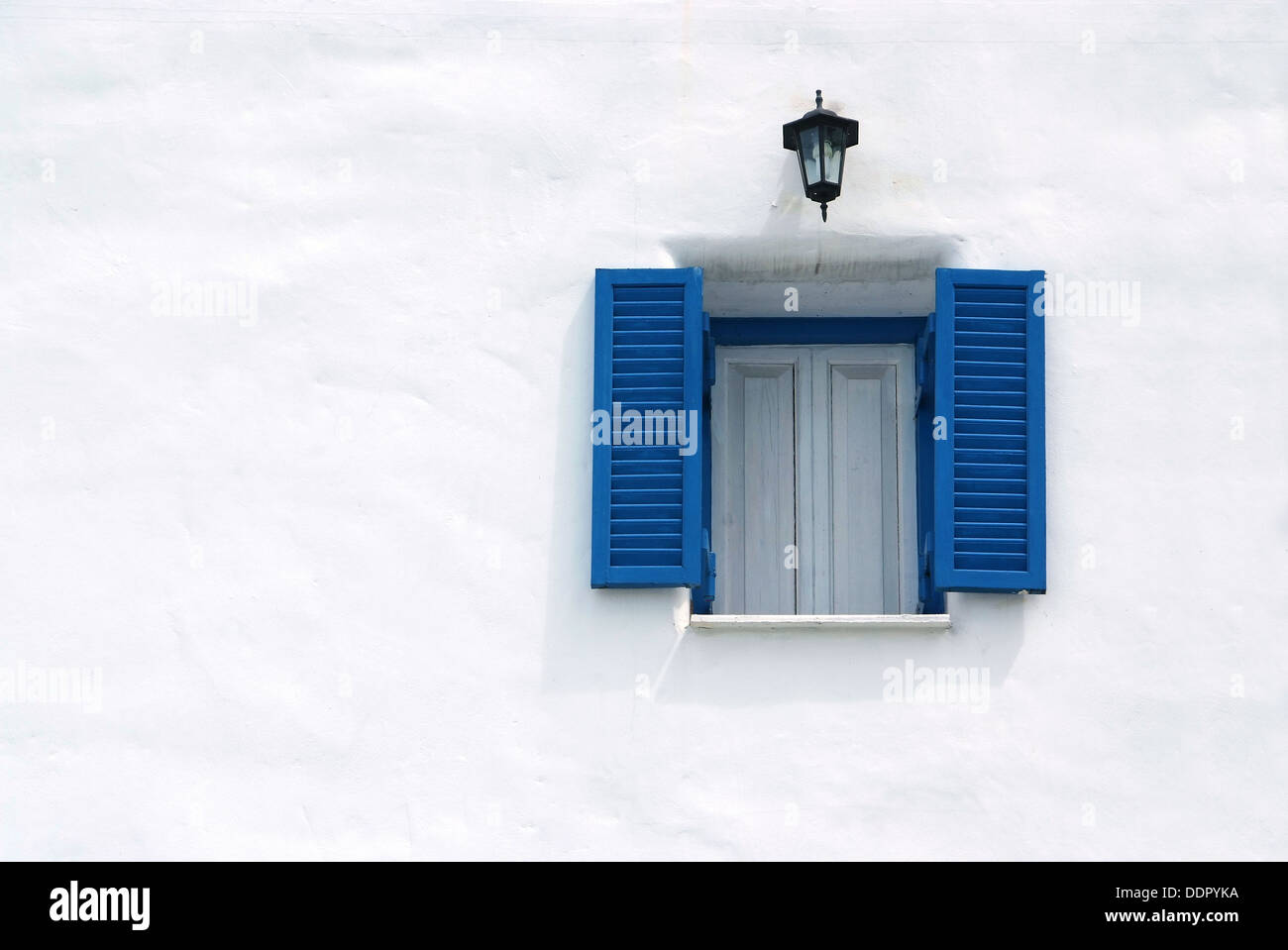 Vintage blue window on the white wall Stock Photo - Alamy