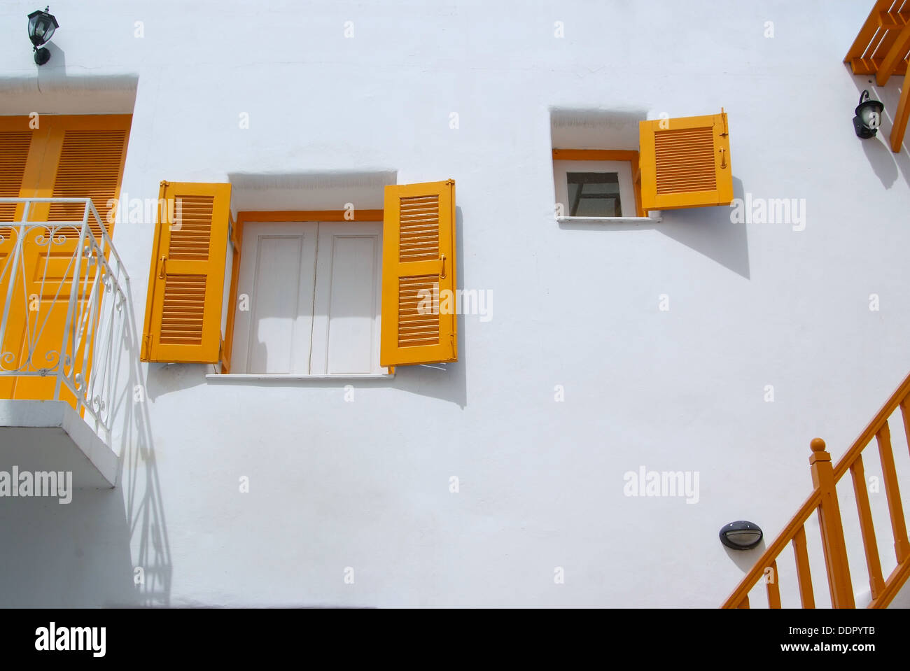 Vintage yellow window on the white wall Stock Photo - Alamy