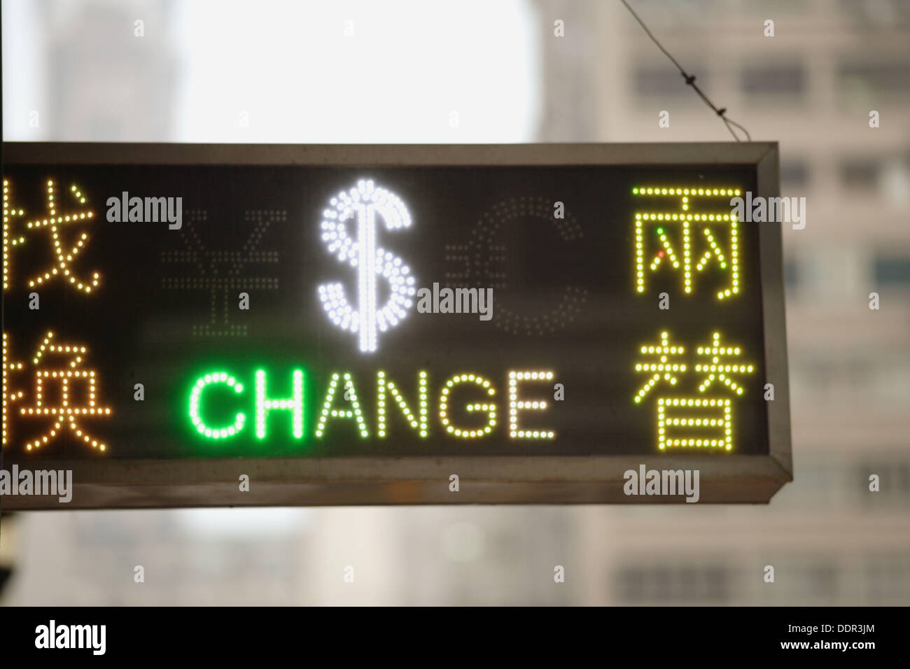 Neon advertising of a money changer with english and chinese characters ...