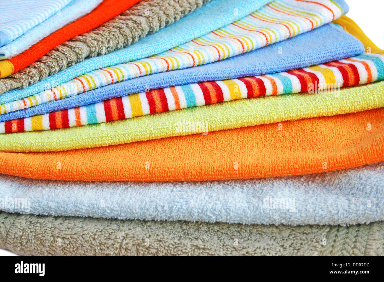 Stack of colorful towels on white background Stock Photo - Alamy