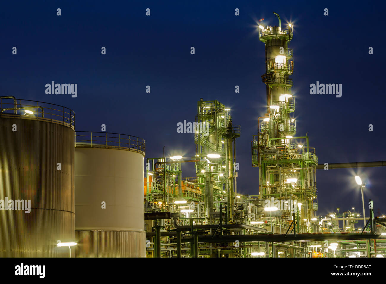 An illuminated chemical plant at night Stock Photo - Alamy