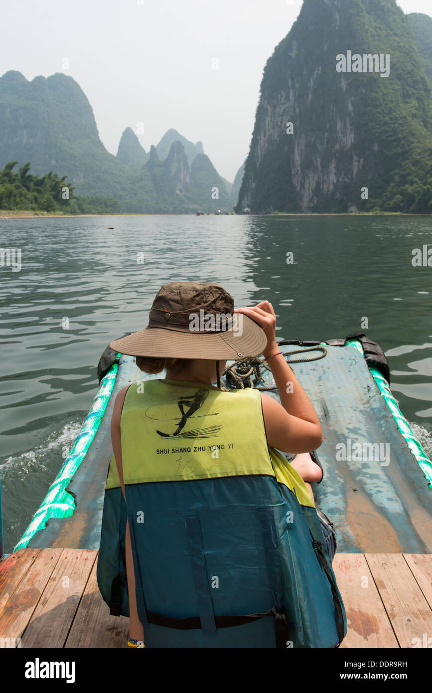 Tourist on a raft in Li River, Yangshuo, Guilin, Guangxi Province ...