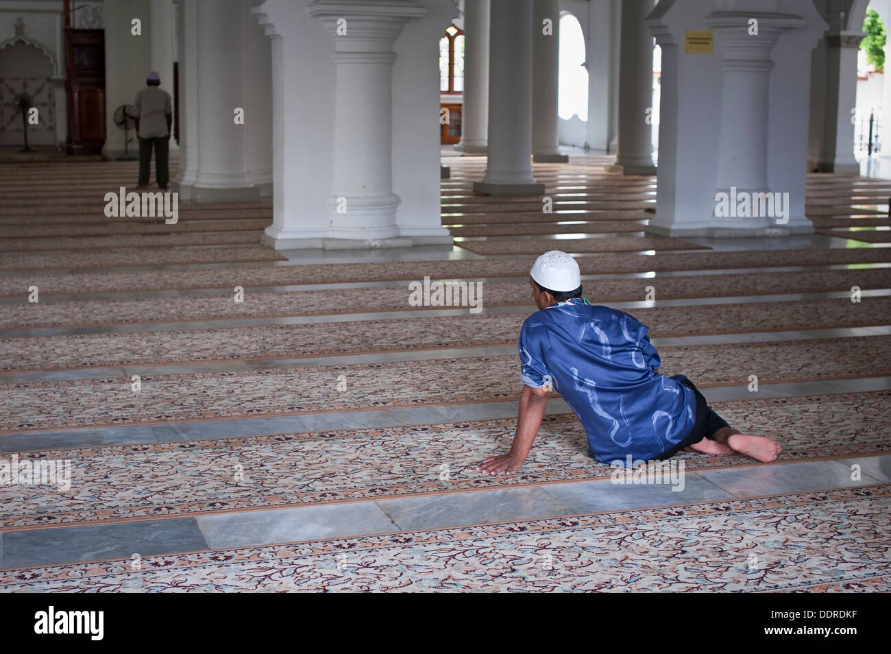 Two Muslim men in the Kapitan Keling Mosque, George Town, Penang Stock ...