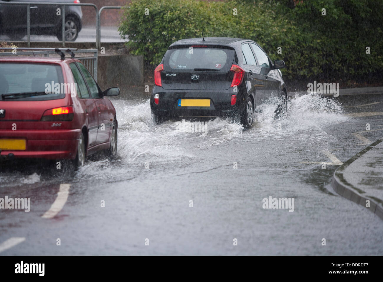 Cars driving through flood hi-res stock photography and images - Alamy
