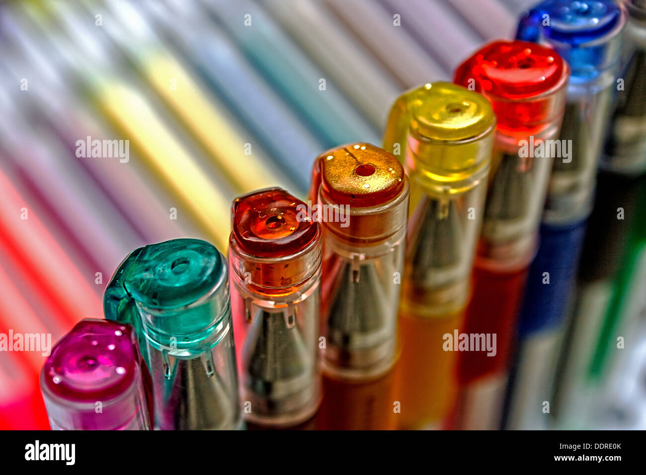 Set of multicolored pens placed on a stand, horizontally and vertically ...