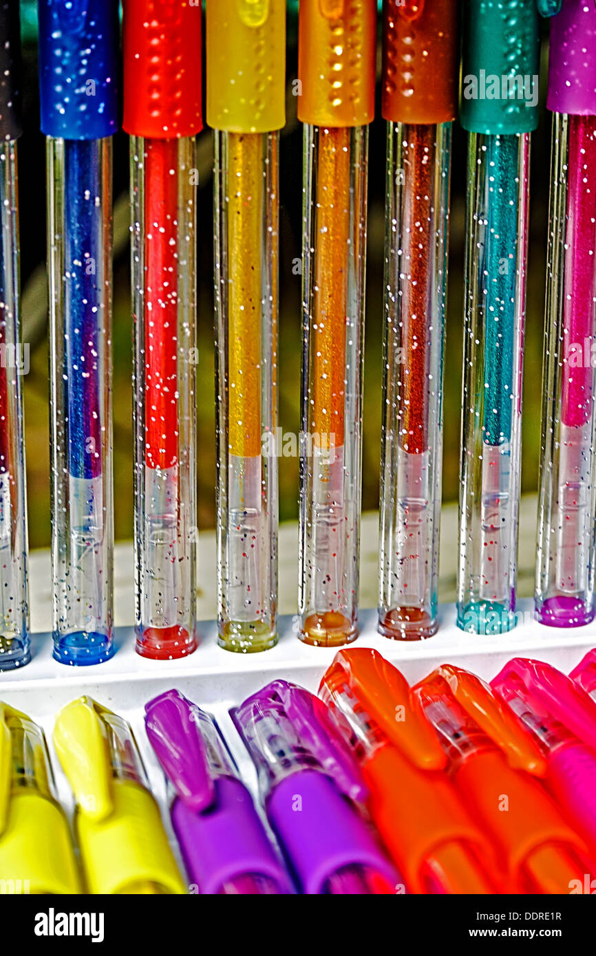 Set of multicolored pens placed on a stand, horizontally and vertically ...
