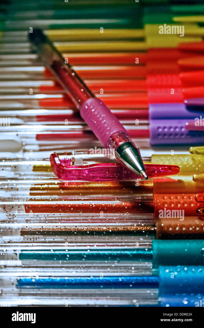Overlapping colored pen and other pens arranged over a substrate Stock ...