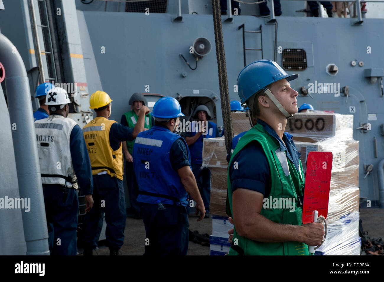 Ship's Serviceman Seaman Alexander Clark communicates with the Military ...