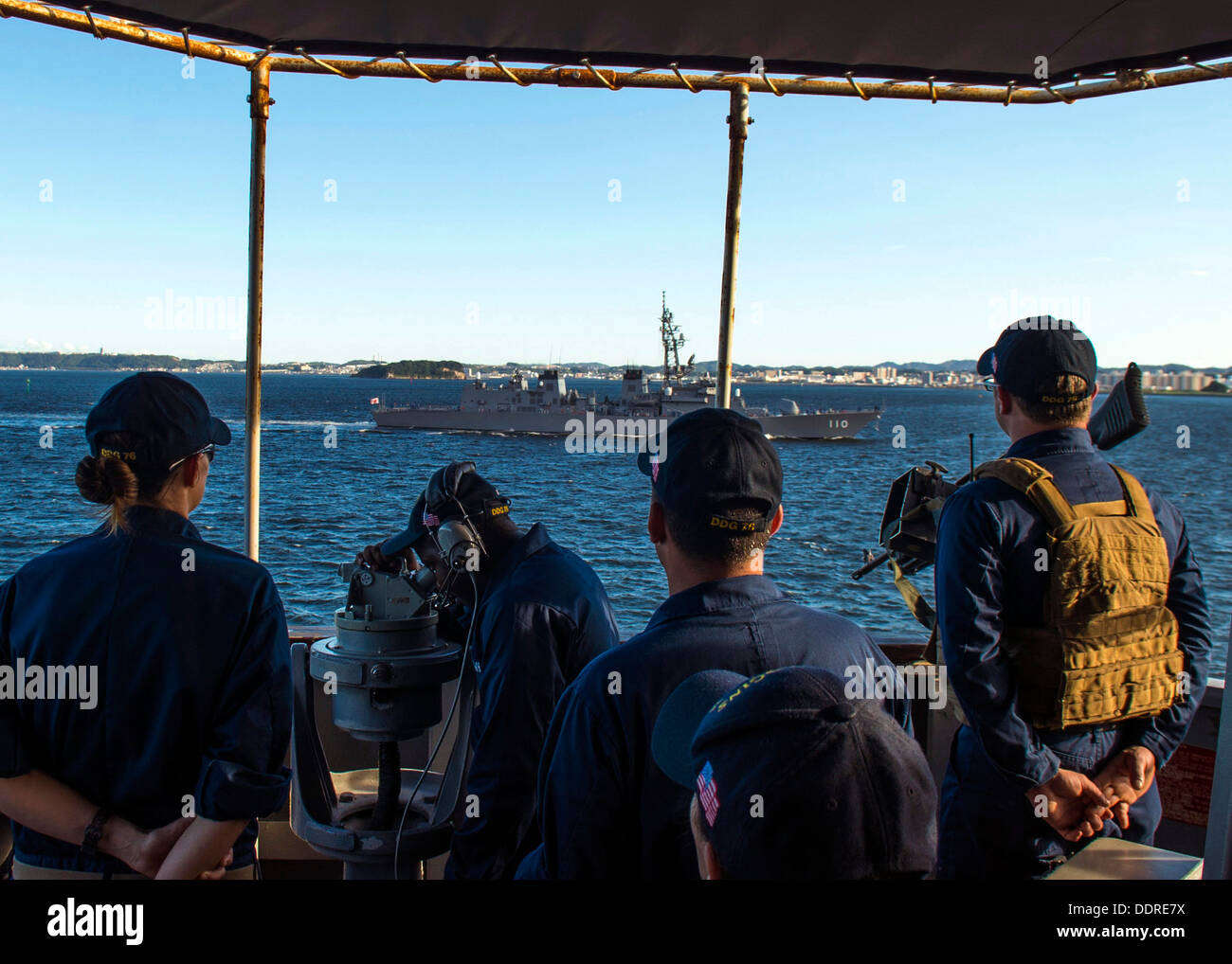 Sailors observe the Japan Maritime Self-Defense Force destroyer ...