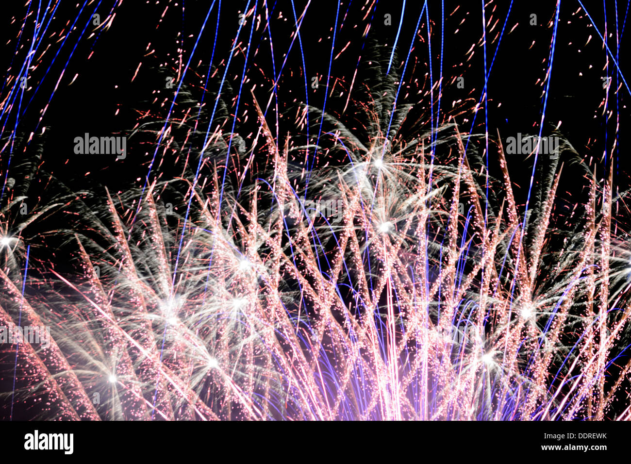 Celebrating with a fireworks display at night Stock Photo - Alamy