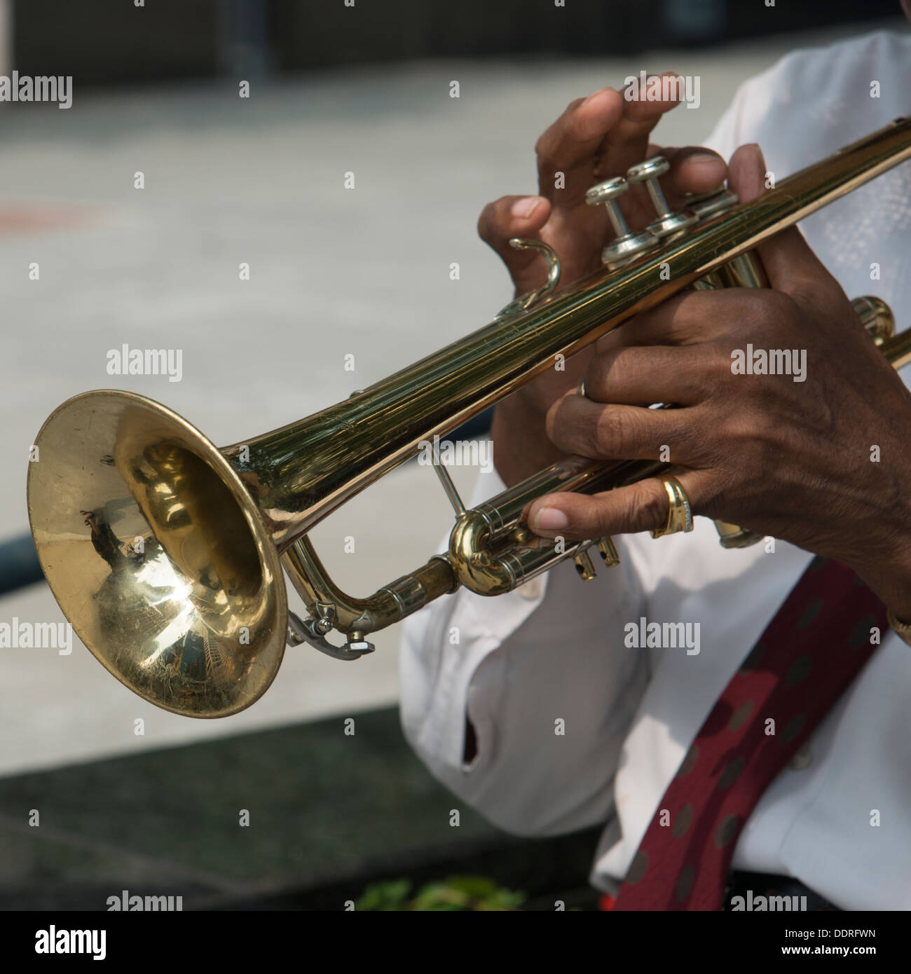 Mid section view of a man playing a trumpet, Chicago, Cook County ...