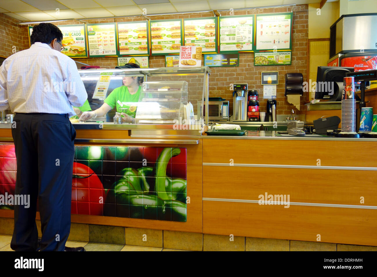 Customer choosing ingredients at a Subway restaurant in Canada Stock ...