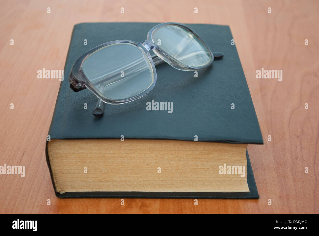 Book and glasses Stock Photo - Alamy