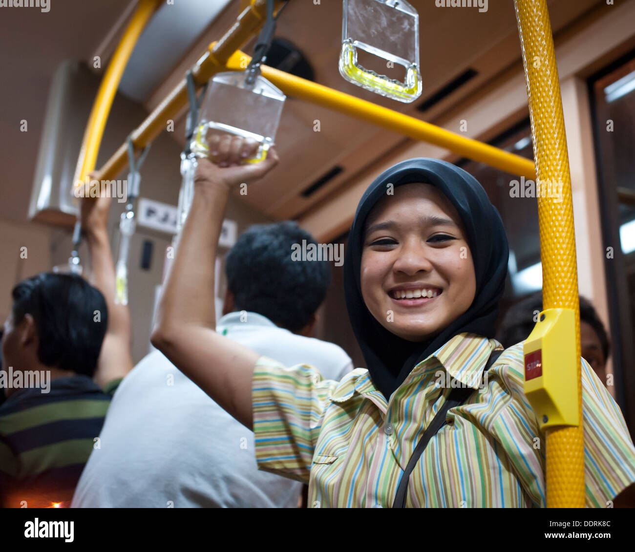 Muslim woman on a bus at night, Penang Stock Photo - Alamy