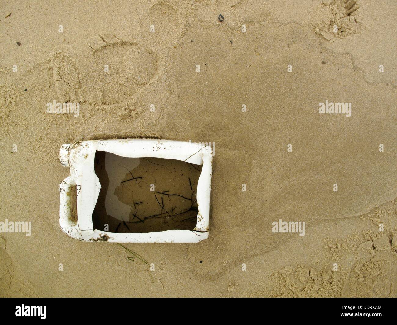 Cut-open plastic container on the beach Stock Photo - Alamy