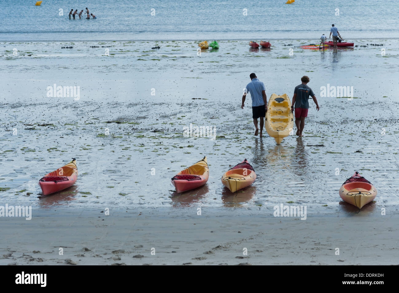 People launching Kayaks in the beach at Cap Coz Brittany France Stock ...