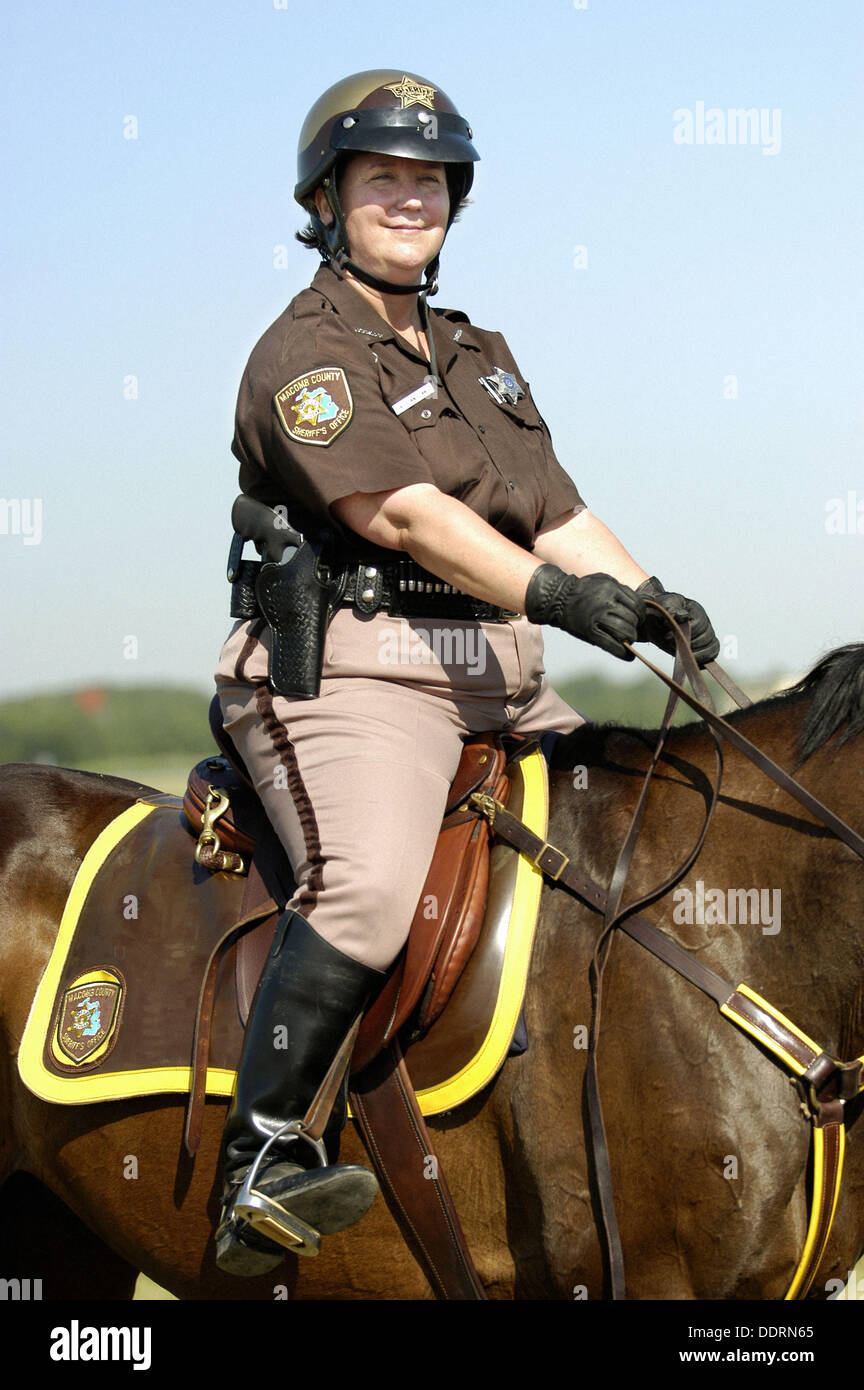 Female Police Officer Riding Horse Stock Photos & Female Police Officer ...