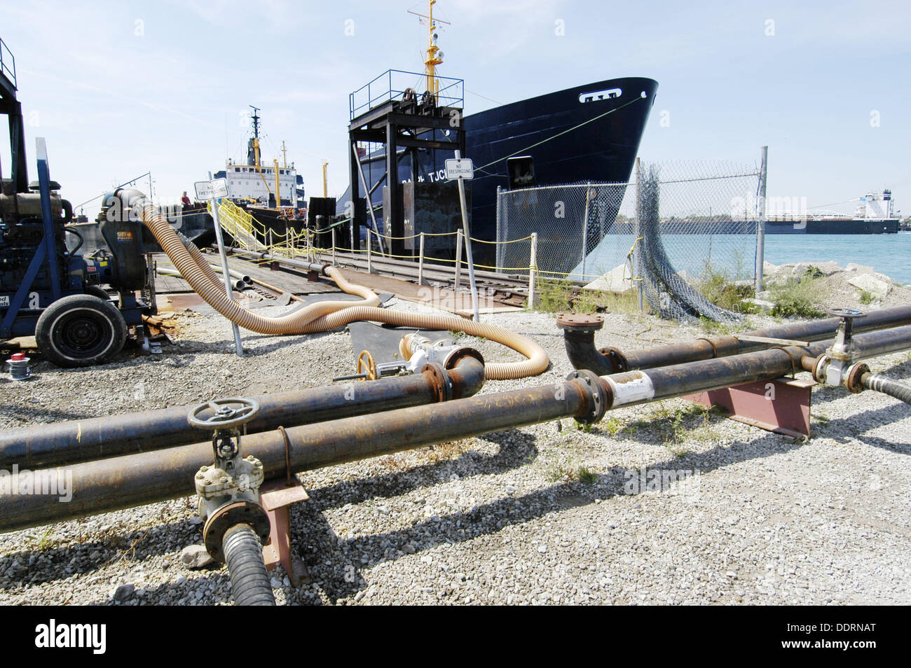 Small ship loading salt brine for use in household products Stock Photo ...