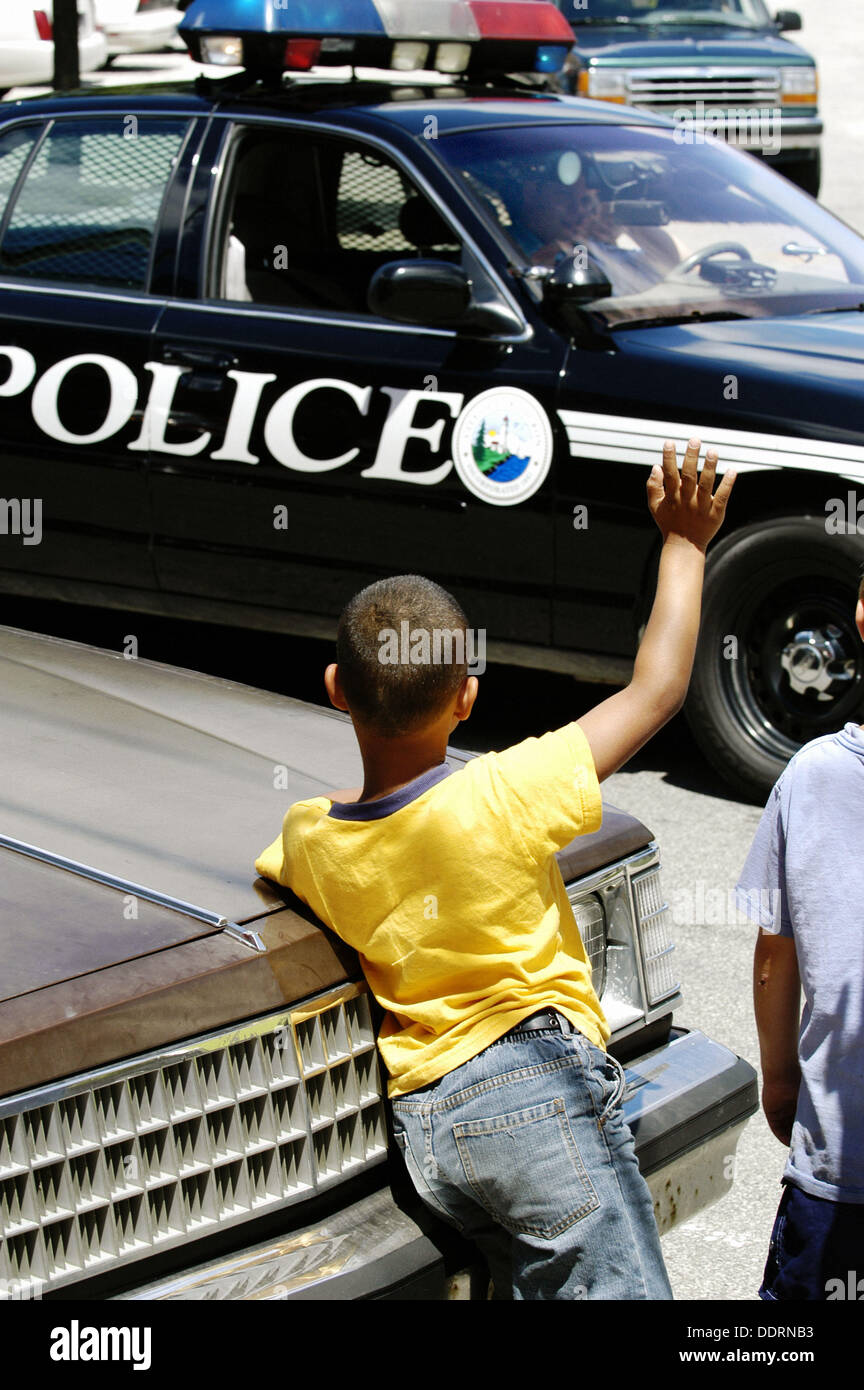 Police officer waving hi-res stock photography and images - Alamy