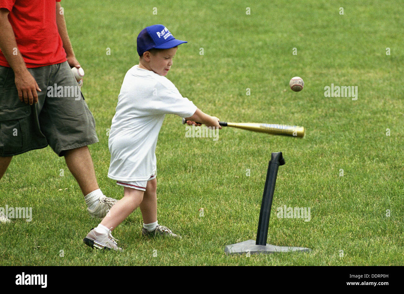 Kid hit ball of a tee hi-res stock photography and images - Alamy