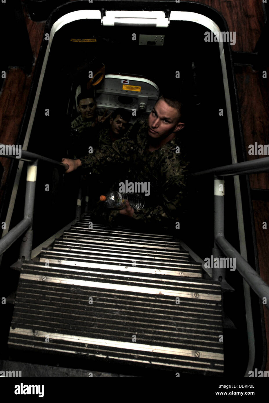 Seabees from Naval Mobile Construction Battalion (NMCB) 3 climb a ...