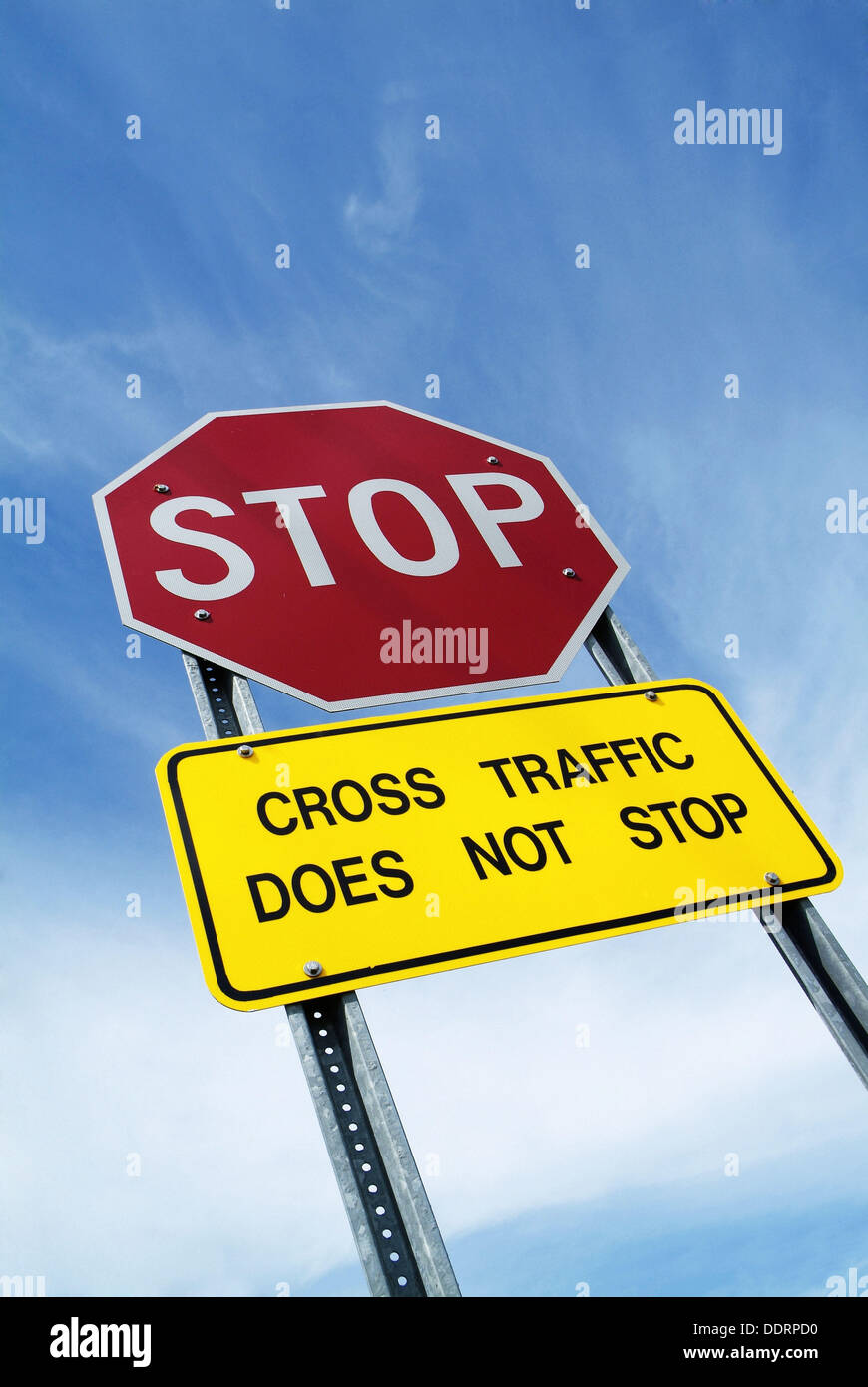 Stop sign warn that crossing traffic does not stop Stock Photo - Alamy