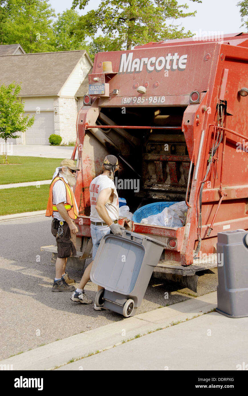 Residential trash collection crew pick up waste products Stock Photo ...