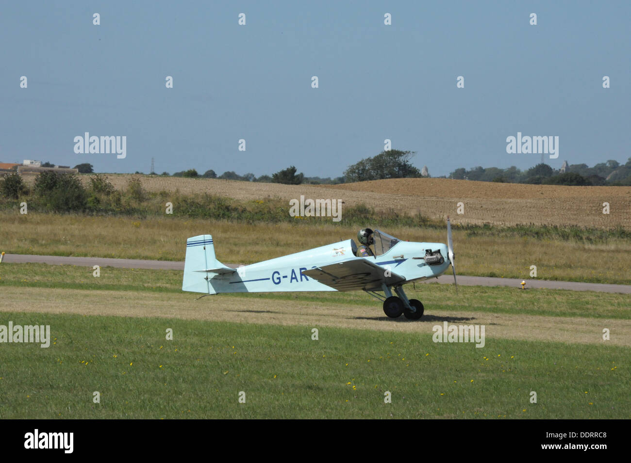 A biplane landing at an airstrip in Shoreham England Stock Photo - Alamy