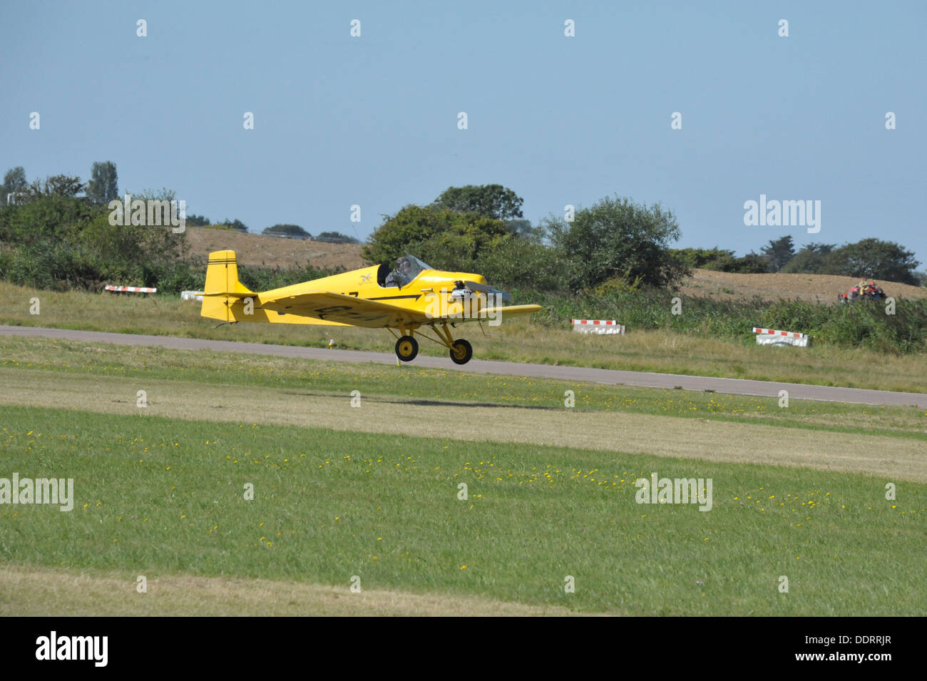 A biplane landing at an airstrip in Shoreham England Stock Photo - Alamy