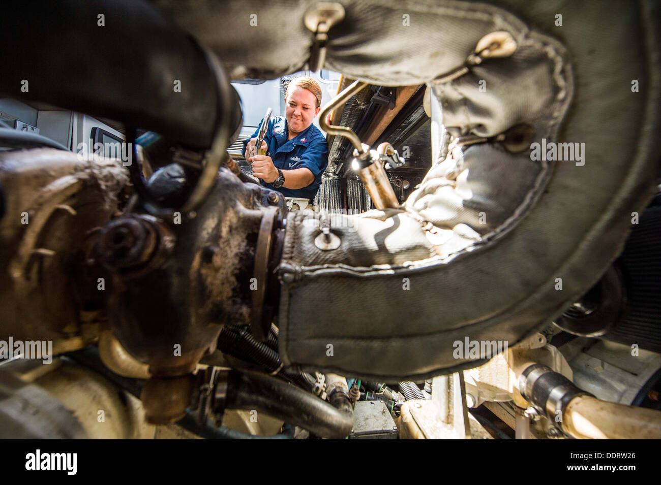 Machinist's Mate 2nd Class Priscilla Fisher works on 11-meter rigid ...