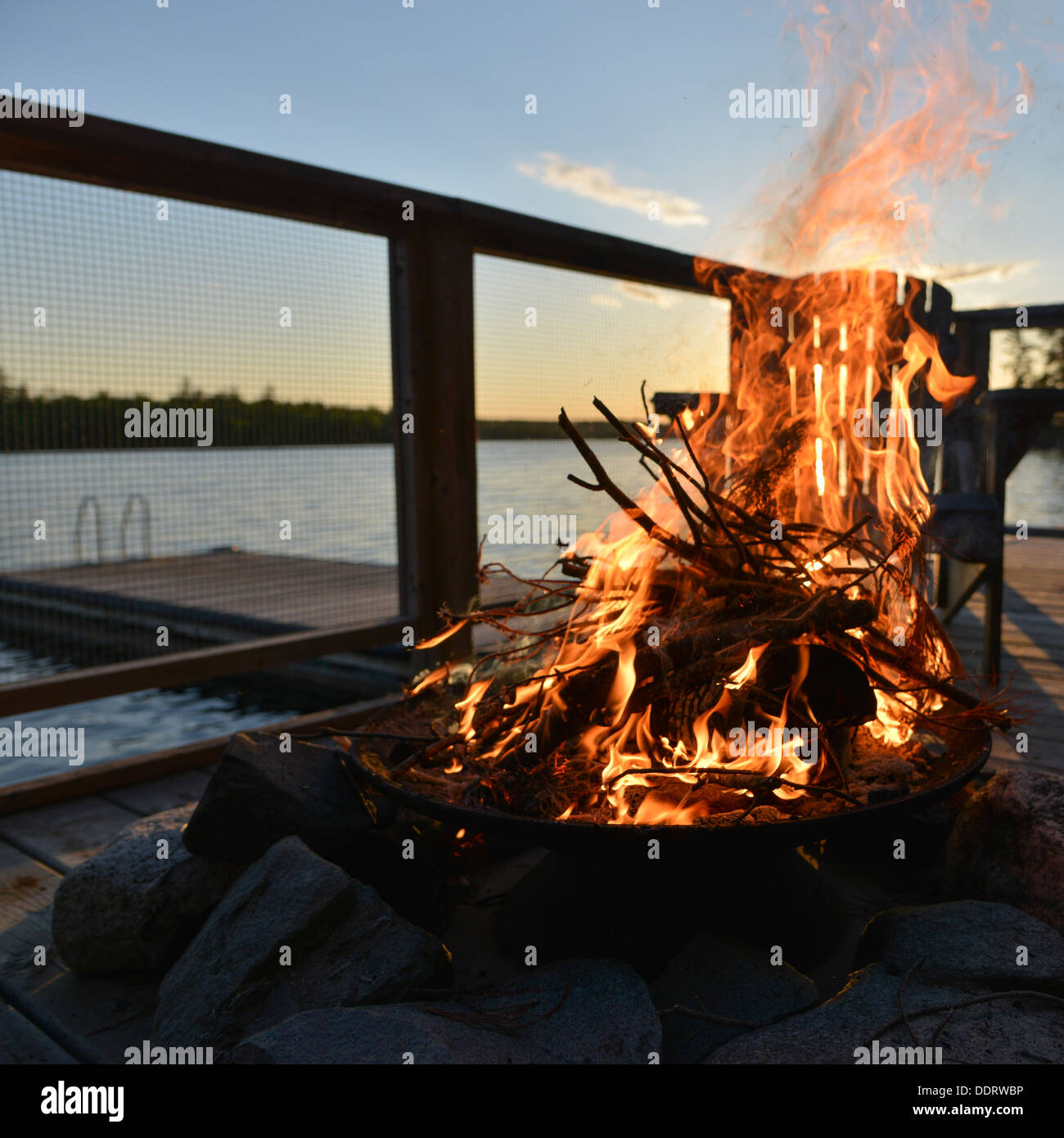 Campfire on a dock, Lake of The Woods, Ontario, Canada Stock Photo - Alamy