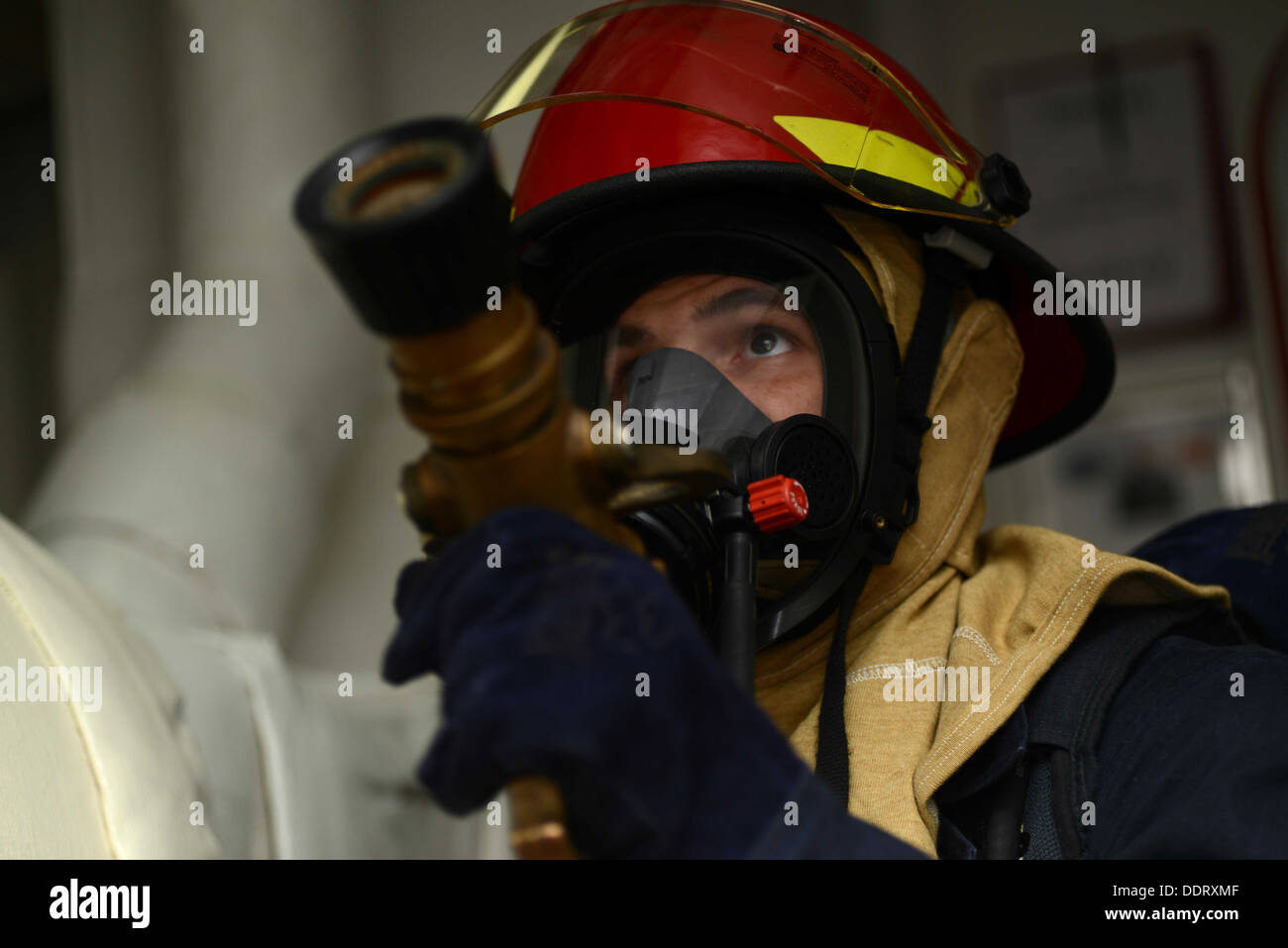 U.S. Navy Intelligence Specialist 3rd Class Dustin Truax simulates fire ...
