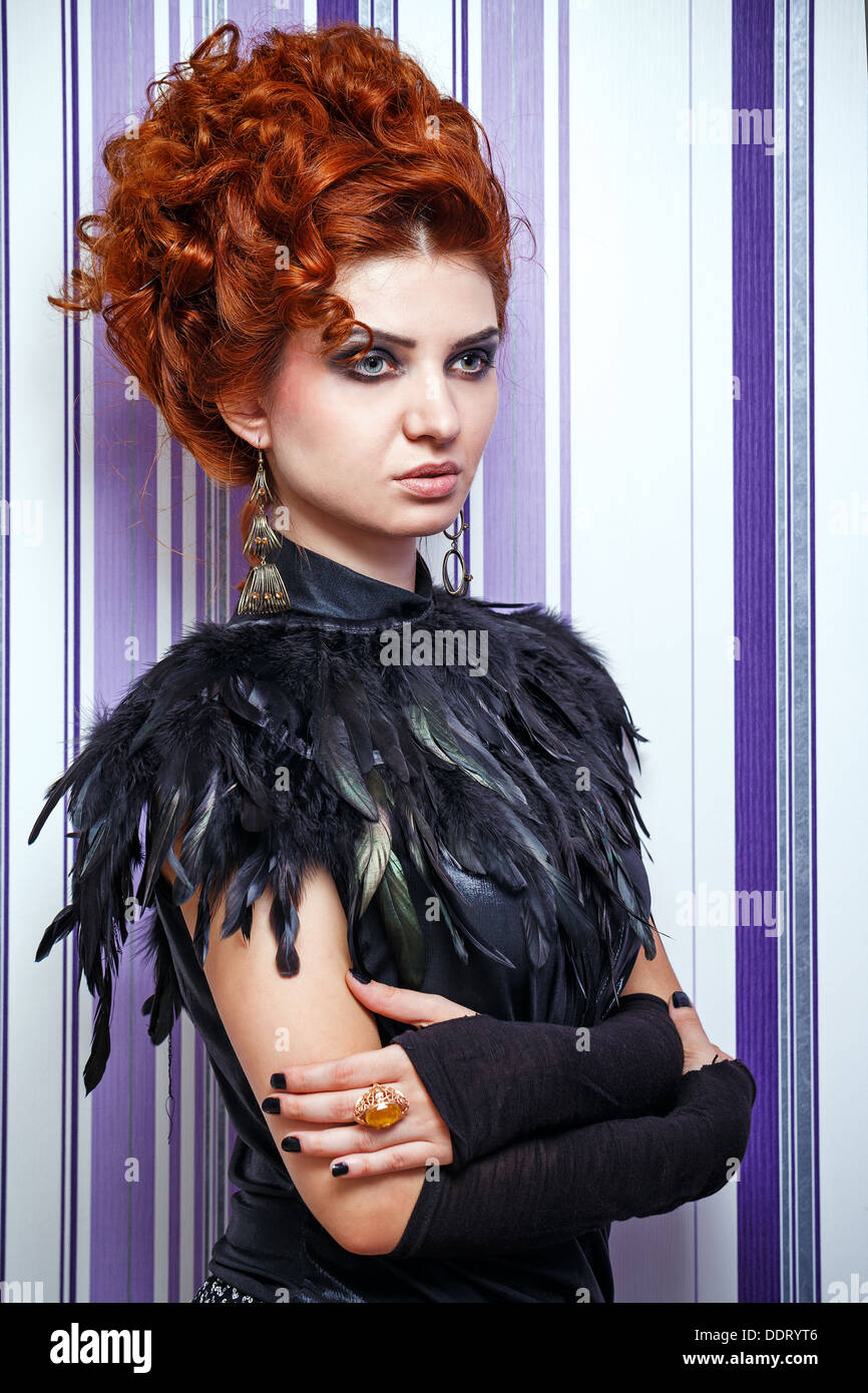 Red-haired lady in an evening dress with a ring on the finger Stock ...