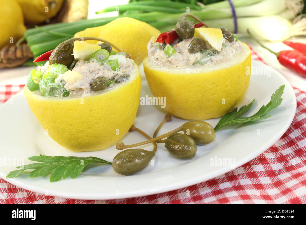 stuffed Lemons with tuna cream and capers on a light background Stock ...