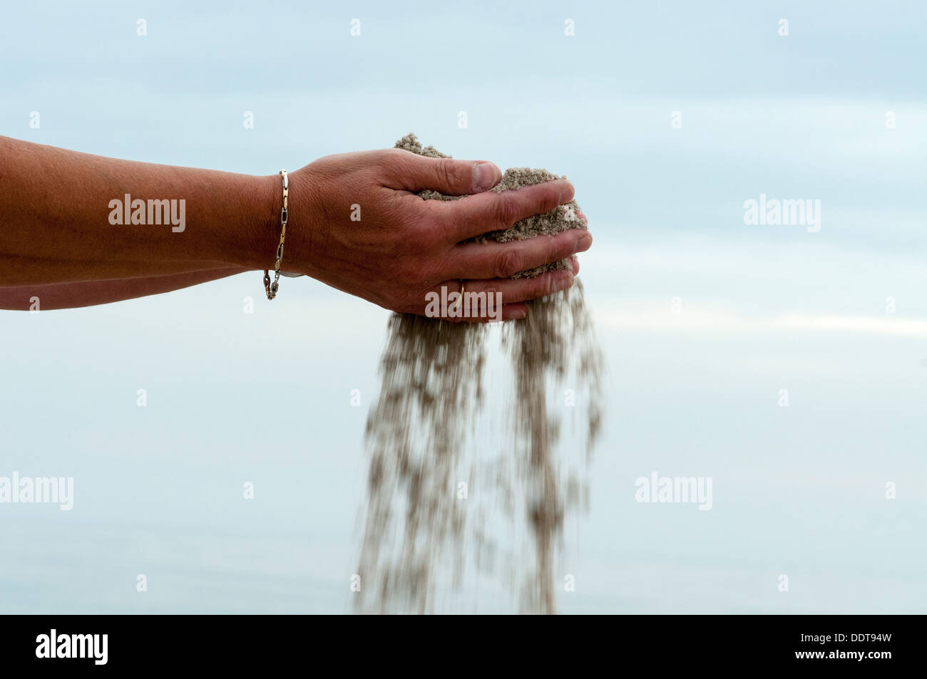 time passing by as sand trough the fingers from the hands Stock Photo ...