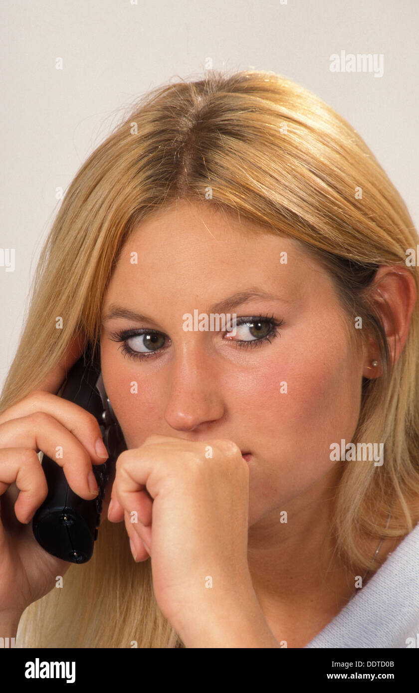 tense woman on telephone Stock Photo - Alamy