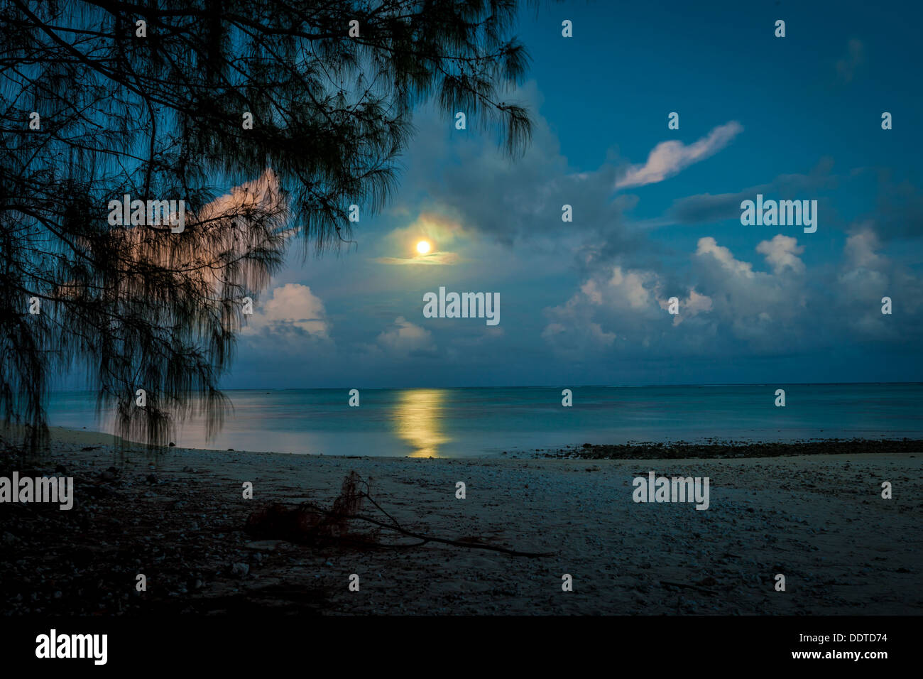 COOK ISLANDS, Aitutaki, tropical island with red sunrise at dawn and ...