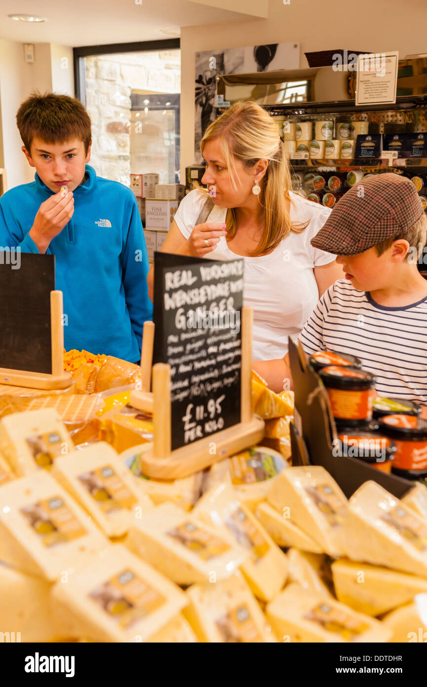 People tasting cheese in The cheese shop in the Wensleydale Creamery ...
