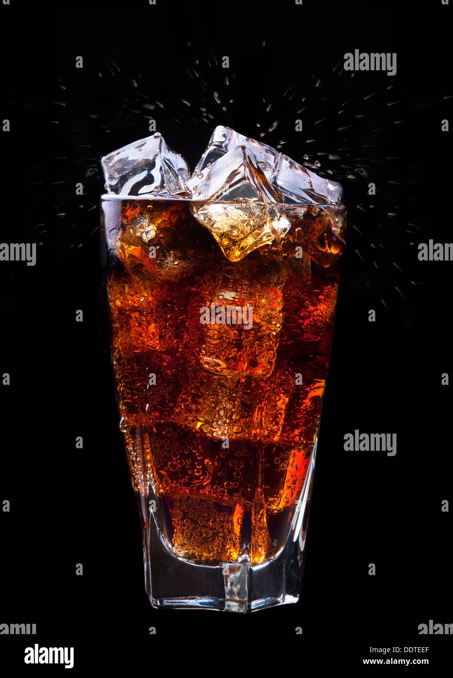 Fresh cola drink background with ice and splash on a black Stock Photo ...