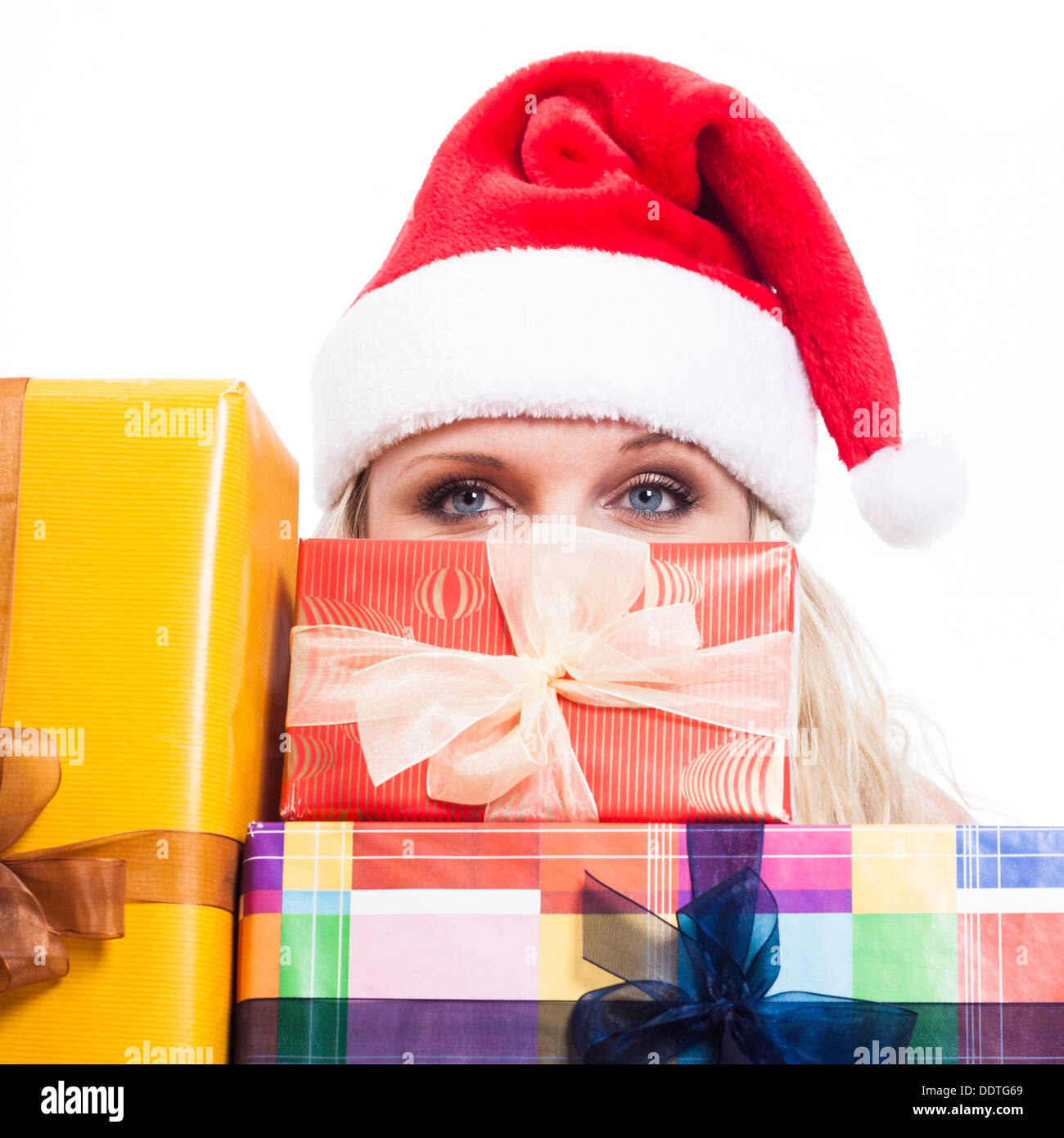 Closeup of secret Christmas woman hiding behind many presents, isolated ...