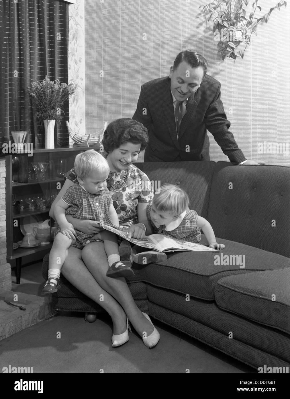 Family group looking at a brochure, Doncaster, South Yorkshire, 1963 ...