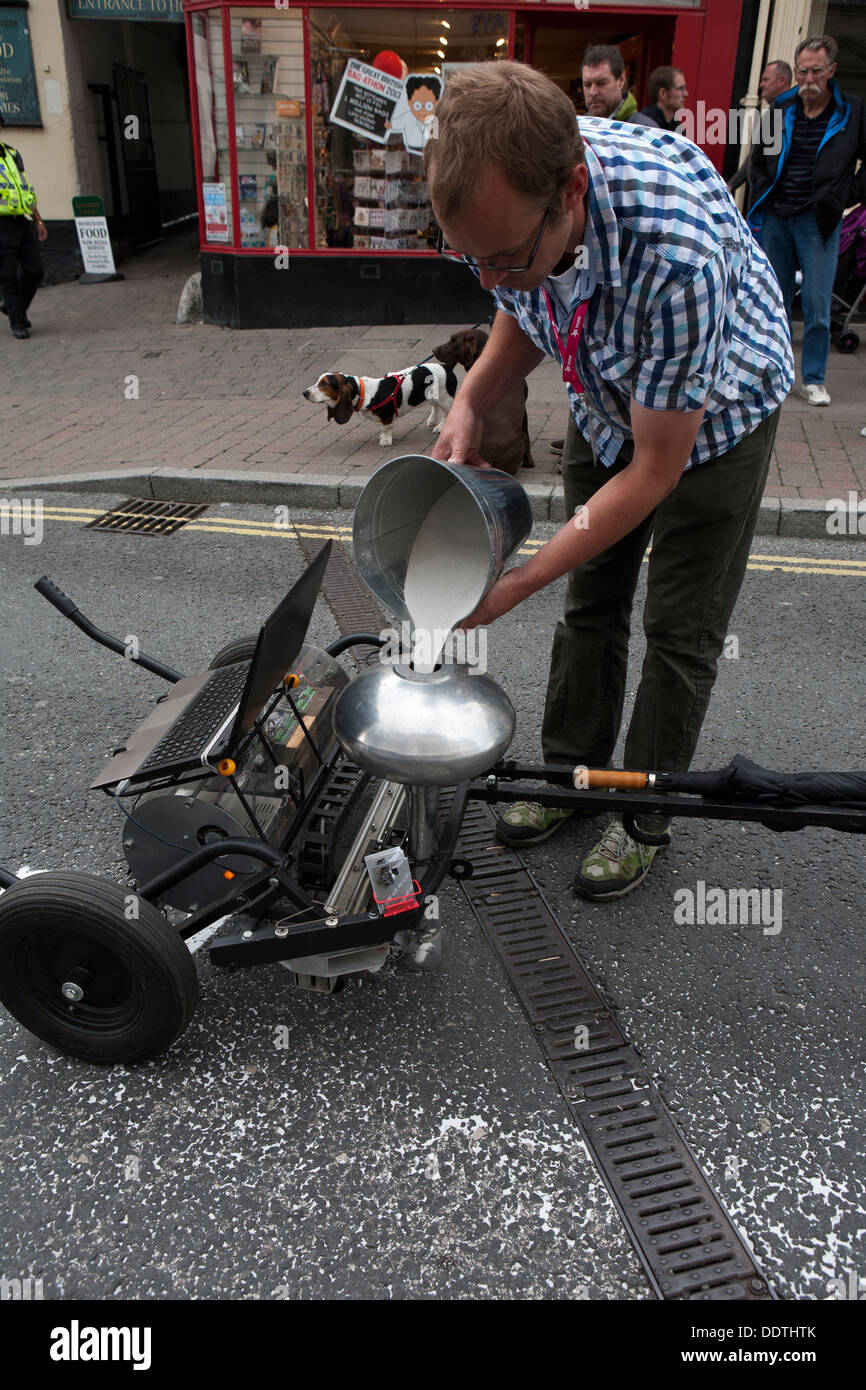 The Skryf sand writer, moving forward leaving a stream of letters ...